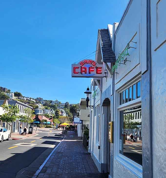 That iconic neon sign against blue California sky marks the spot where countless memorable meals and celebrations have happened over the decades.