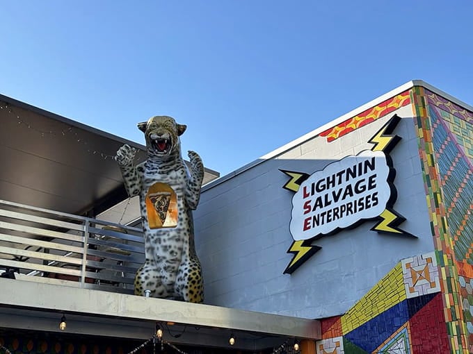 A giant leopard statue guards the rooftop because normal restaurant decorations are for places that take themselves way too seriously.