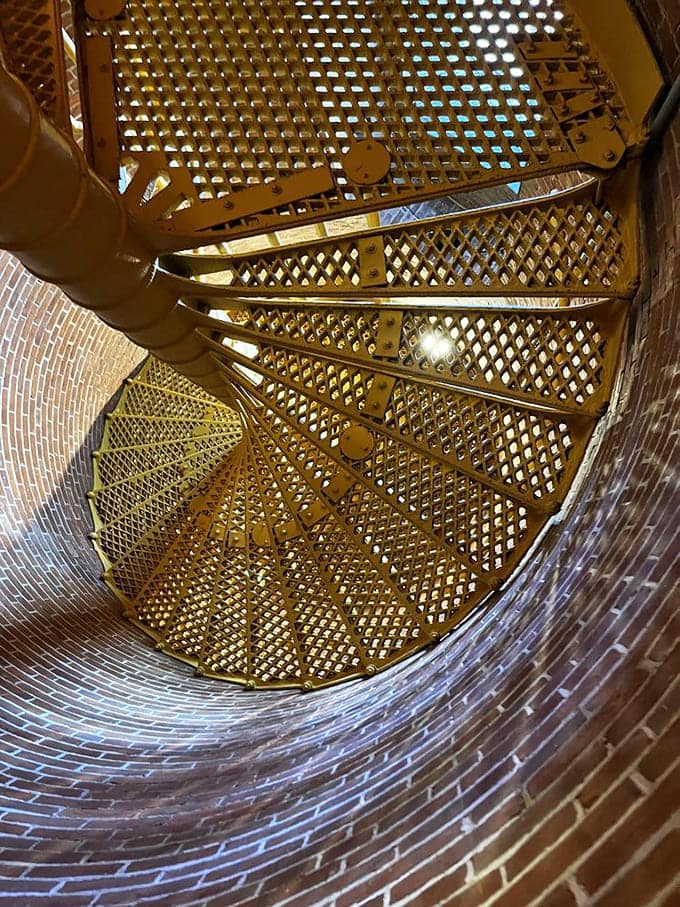 These spiral stairs wind upward through the tower, each step echoing with over a century of footfalls.