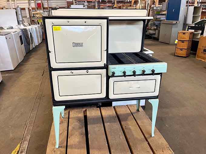 A vintage enamel stove that's seen more home-cooked meals than most modern kitchens will in their entire lifetime.