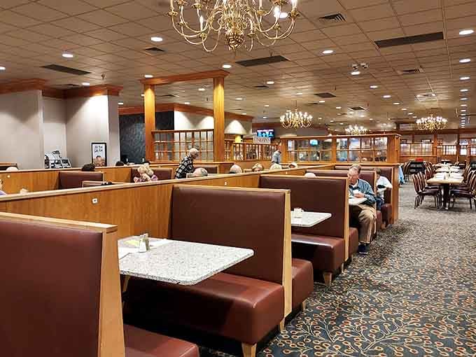 Comfortable booths with granite-topped tables stretch into the distance, ready to support your multiple plate trips with dignity.