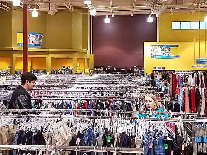 Serious thrifters navigate the racks with the focus of archaeologists, knowing that patience reveals the best treasures.