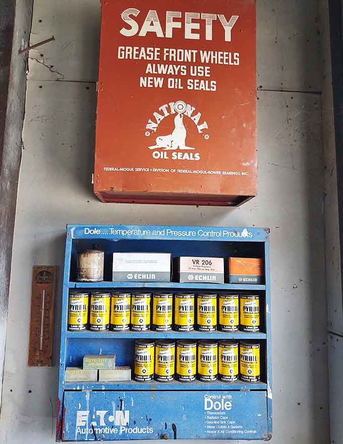 Shelves stocked with automotive products displaying graphics that prove advertising used to be an actual art form, not algorithms.