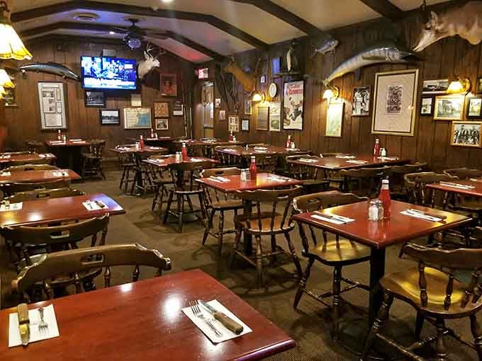 Cozy dining room with wooden tables and framed memories on every wall, where regulars probably have their own unofficial assigned seats by now.