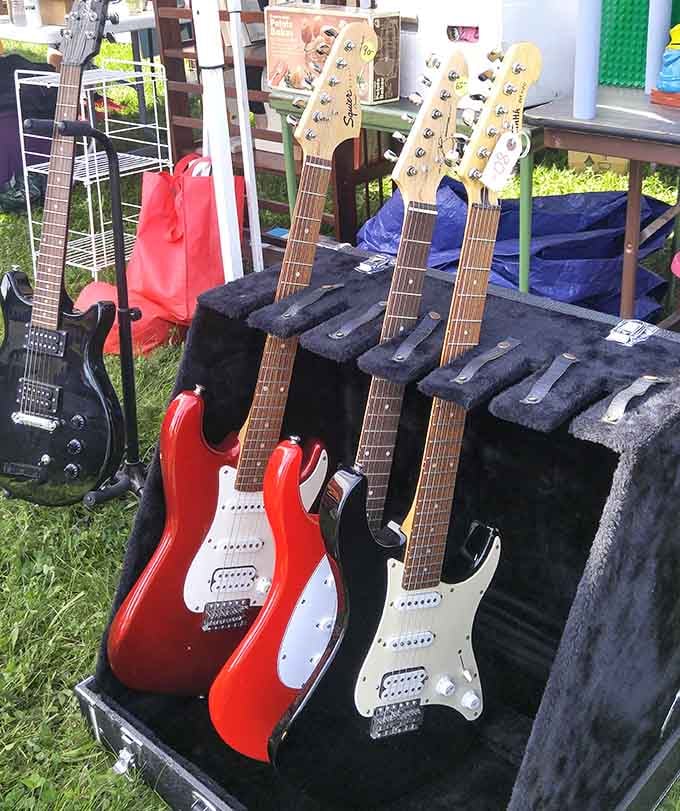 Guitars waiting for someone to make music again, each one holding the potential for a garage band comeback story.