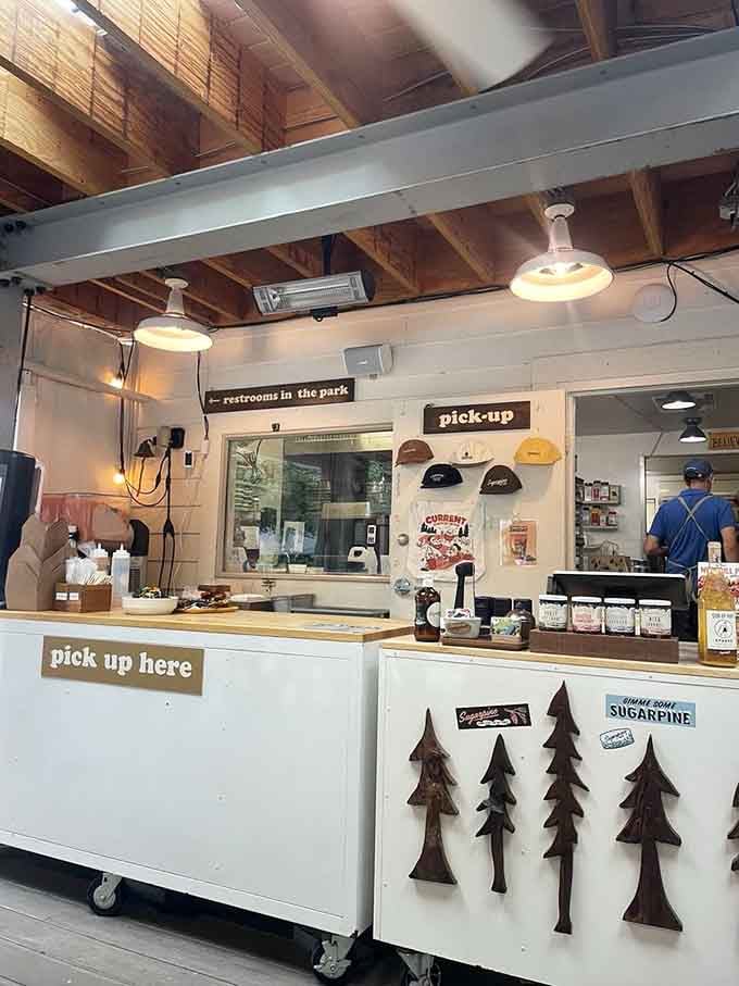 The pickup counter decorated with pine trees reminds you that Oregon's natural beauty extends indoors too.