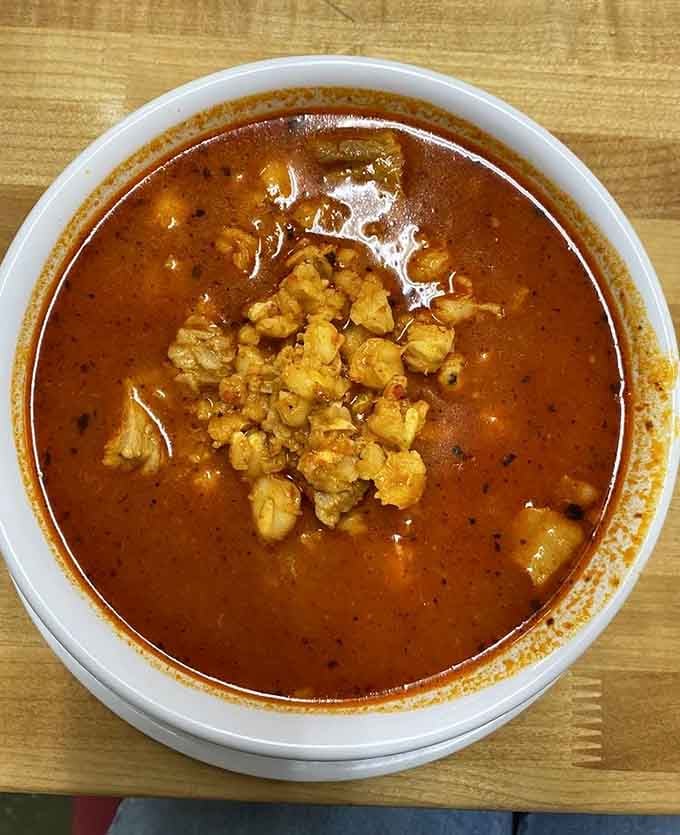 Rich pozole with hominy floating in red chile broth. This is grandmother's recipe brought to life perfectly.