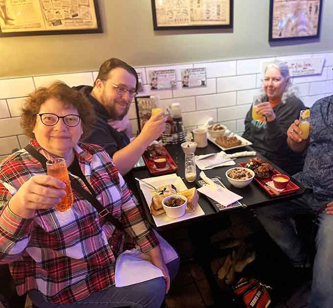Happy diners raising their glasses prove that good food and vintage vibes create instant breakfast camaraderie.