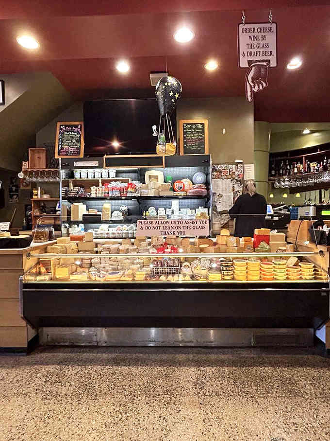 The main counter where magic happens, stocked with cheeses and condiments that transform bread into culinary art.