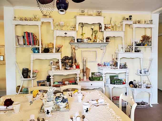 White shelving displays treasures and trinkets that reward careful observation, like an I-Spy book came to life around you.