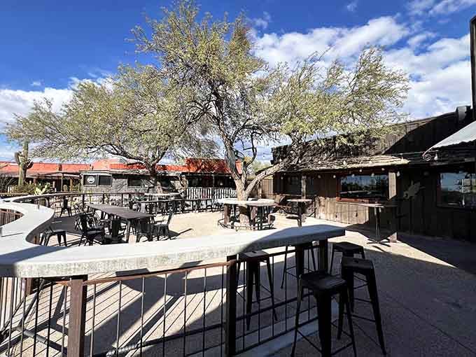 The outdoor patio offers desert views and shade trees, perfect for those evenings when Arizona weather cooperates beautifully.