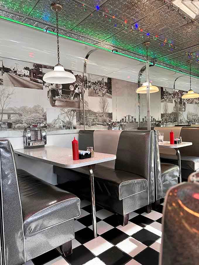 Booth seating with vintage photographs on the walls, where conversations happen and memories get made.