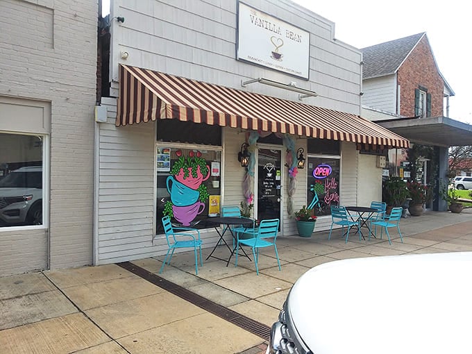 The Vanilla Bean's cheerful storefront and turquoise chairs invite lingering conversations over coffee that costs less than your monthly streaming service.