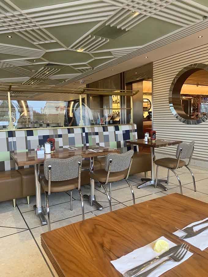 Geometric ceiling details and chrome accents prove that diner design peaked decades ago and never looked back.