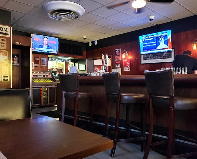 The bar beckons with cold drinks and warm conversation, a neighborhood gathering spot through and through.