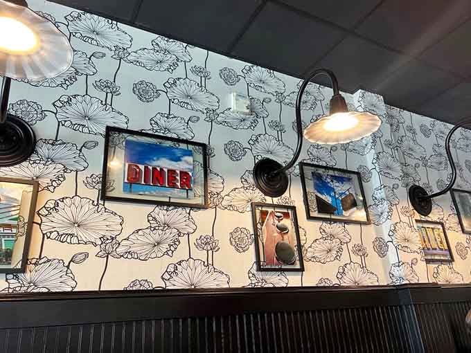 Vintage diner signs and black sconce lighting create that perfect Instagram moment without trying too hard to be trendy.