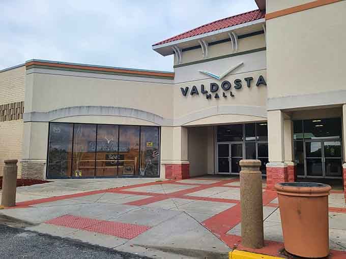 The Valdosta Mall's understated entrance belies the shopping adventures waiting inside, where air conditioning provides blessed relief from Georgia's summer heat.