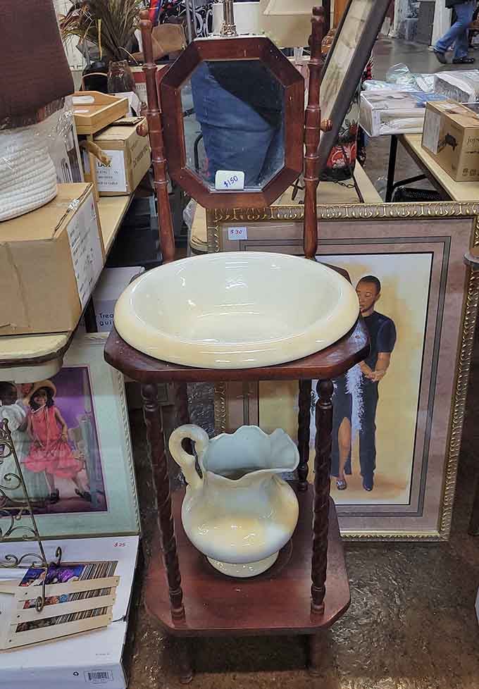 Vintage washstand elegance meets modern repurposing possibilities. That porcelain pitcher is just waiting to hold someone's garden flowers.