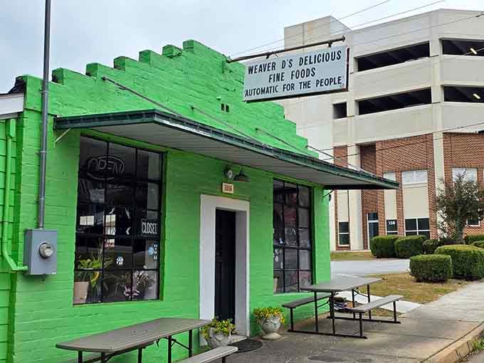 That bright green building with outdoor seating practically glows like a beacon for hungry souls.