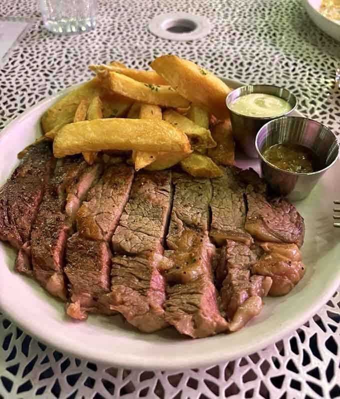 Sliced steak with crispy fries and dipping sauces proves that dinner at a diner can be fancy.