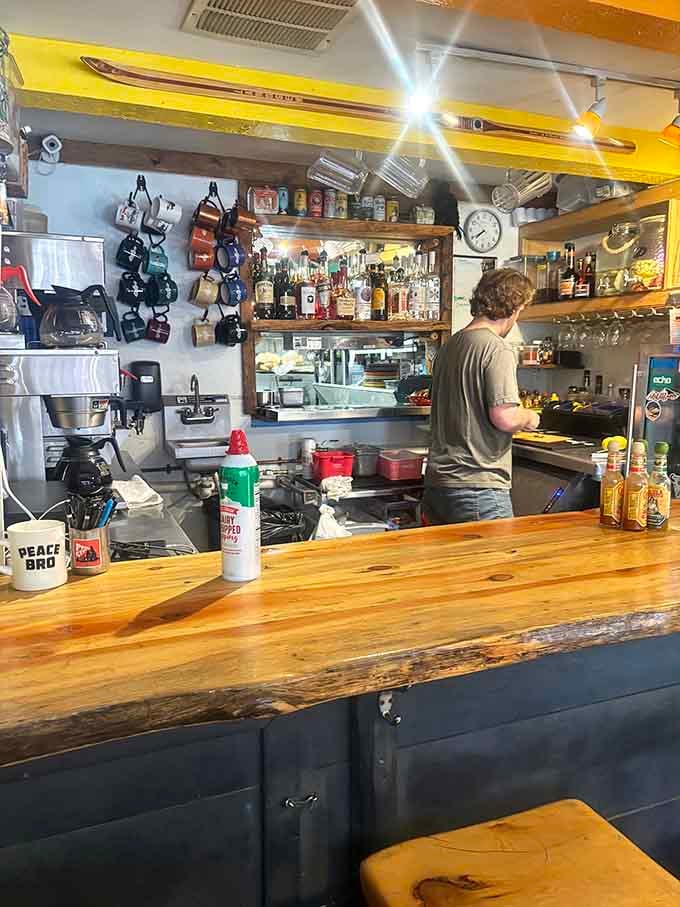 The open kitchen and bar setup lets you watch breakfast magic happen while contemplating your next visit before finishing this one.