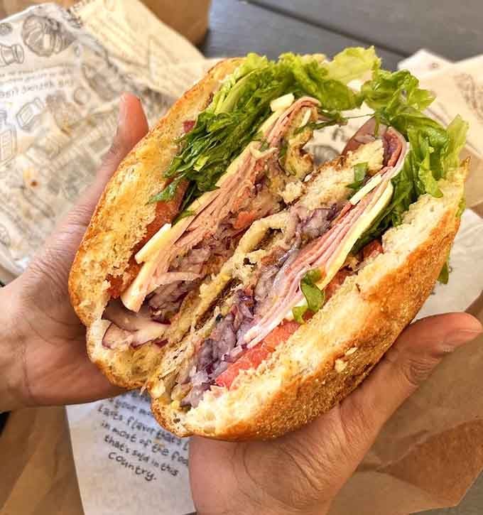 That Italian sub is stacked so high it defies the laws of physics and common sandwich decency.