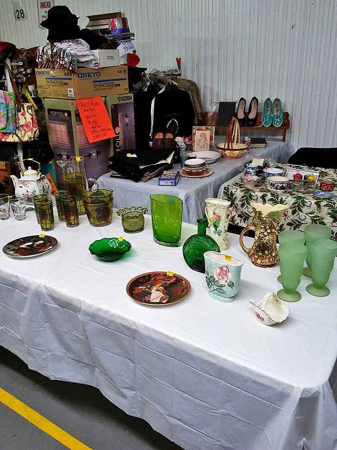 Vintage glassware catches the light on crowded tables, each piece whispering stories of dinner parties and special occasions long past.