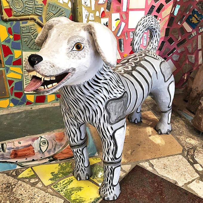 Who let the art out? This whimsical canine creation proves that even man's best friend gets the mosaic treatment here.