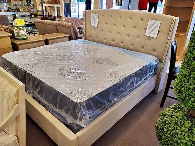 This elegant upholstered bed frame with pristine mattress isn't just sleeping quarters&mdash;it's the cornerstone of your next bedroom makeover.