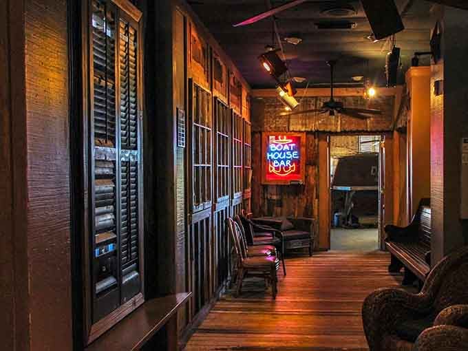 The Boat House Bar's warm wooden tones and neon glow create the perfect spot for swapping fish tales over cold drinks.