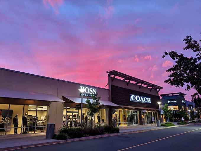 The sunset creates a magical backdrop for Coach and Boss, turning an ordinary shopping trip into retail theater.