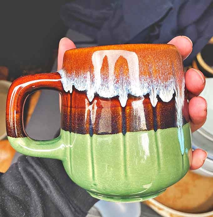 This artisan mug with its dripping glaze proves that morning coffee tastes better when sipped from something with character and history.