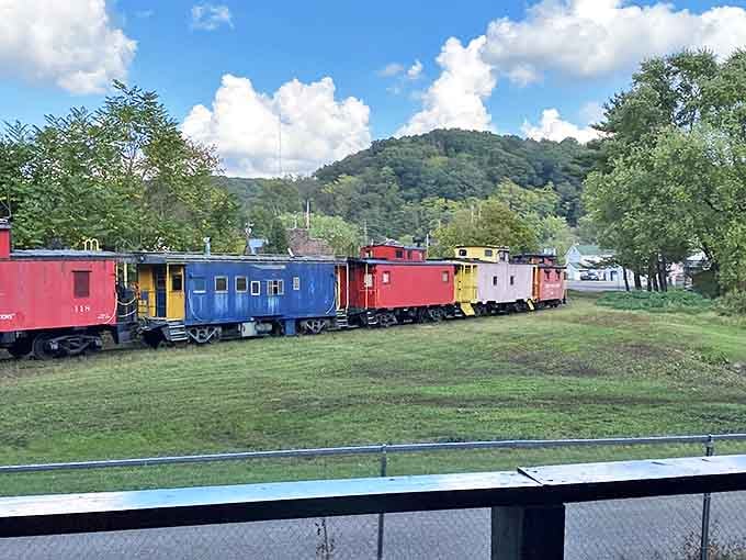 A rainbow of cabooses against rolling hills creates a scene so perfectly Ohio it could be on a postcard &ndash; or your next holiday card.