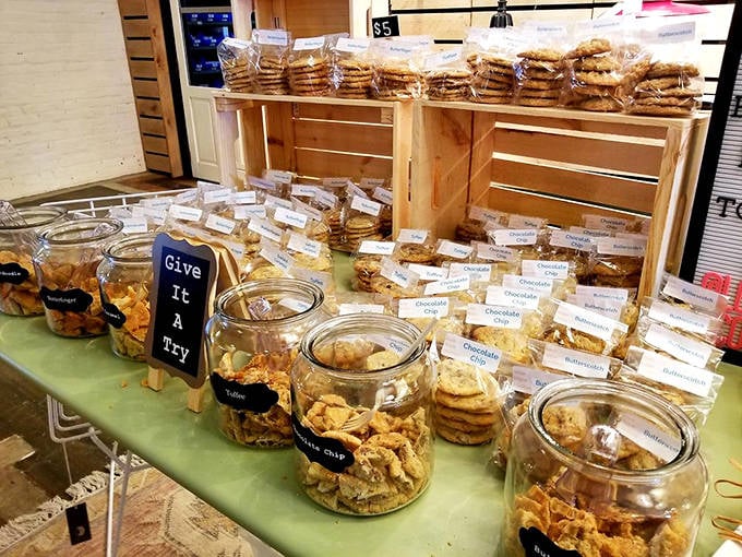 "Give It A Try" invites the handwritten sign, as jars of homemade cookies promise sweet rewards for the adventurous market-goer.