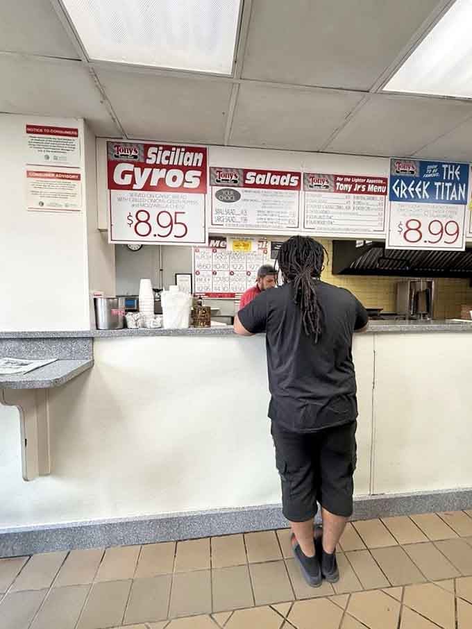 The ordering counter: where dreams are voiced, sandwiches are born, and diet plans go to die gloriously.