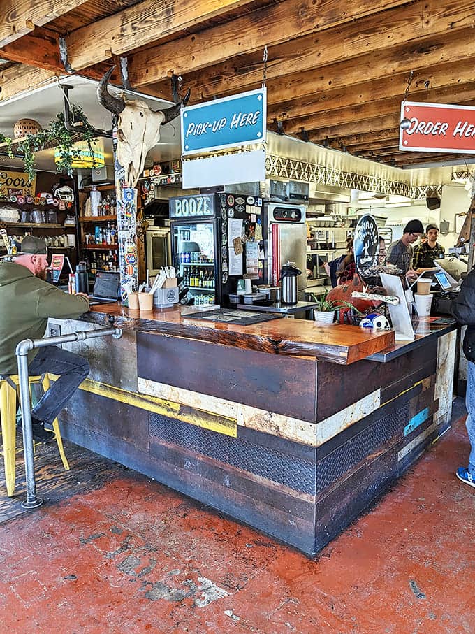 Where burrito dreams come true. The counter's rustic charm and "BOOZE" sign hint at the establishment's perfect priorities.