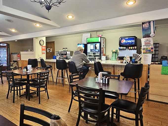 Classic diner seating where locals gather to solve world problems over coffee and where strangers become friends over pancakes.