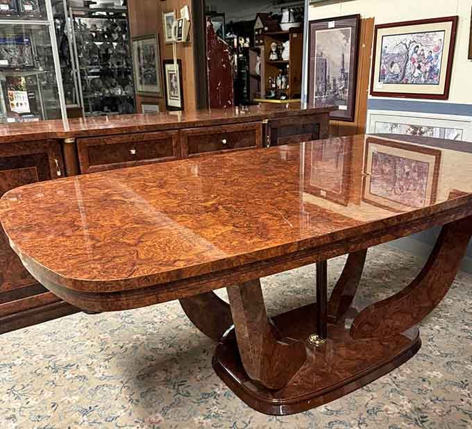 Burl wood that gleams like liquid amber. This Art Deco dining table isn't just furniture—it's functional sculpture waiting for its next dinner party.
