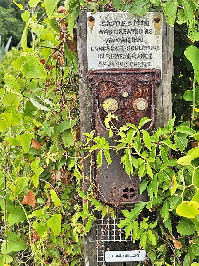 Hidden among the greenery, this weathered plaque reveals Castle Otttis's spiritual purpose&mdash;an "original landscape-sculpture" created as a religious tribute.