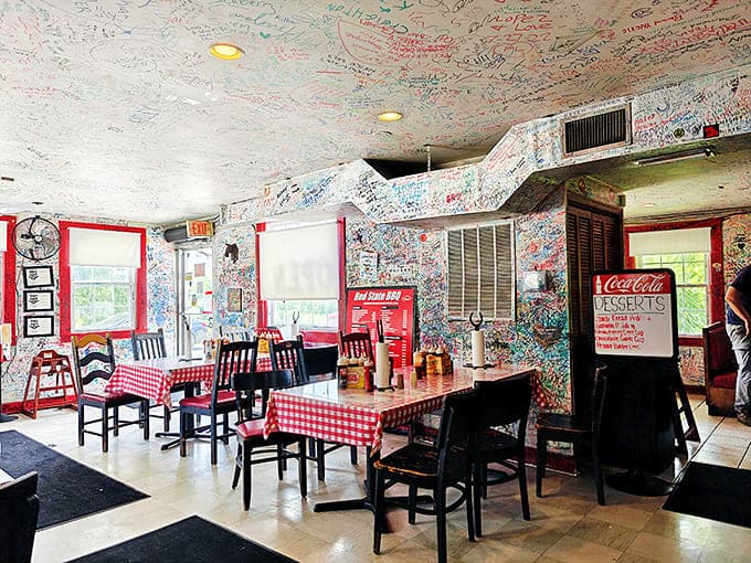Where barbecue pilgrims leave their mark on every available surface. The graffiti-covered walls and ceiling are a guest book of satisfied stomachs.
