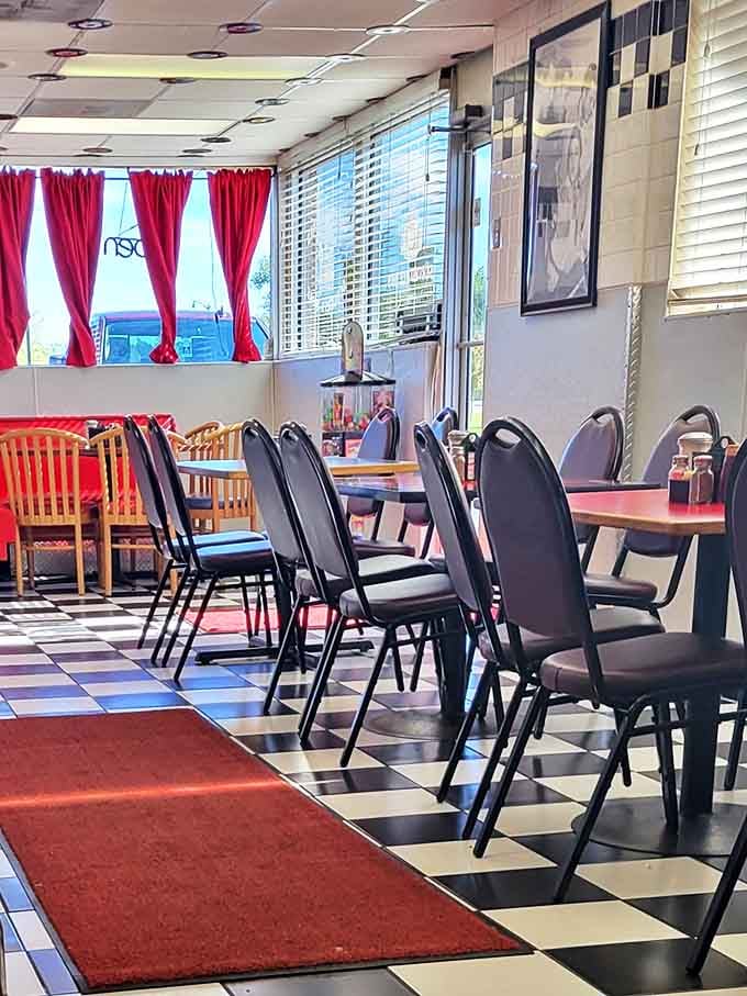 Simple, no-nonsense seating with pops of red that says, "We focus on the food, not fancy furniture," and we love them for it.