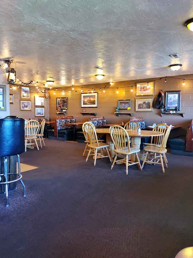 String lights cast a gentle glow across wooden tables, creating the kind of atmosphere where food tastes better and conversations flow easier.