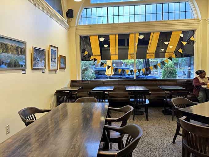 The seating area—simple, unpretentious, and bathed in natural light—where strangers become friends over shared frosting experiences.