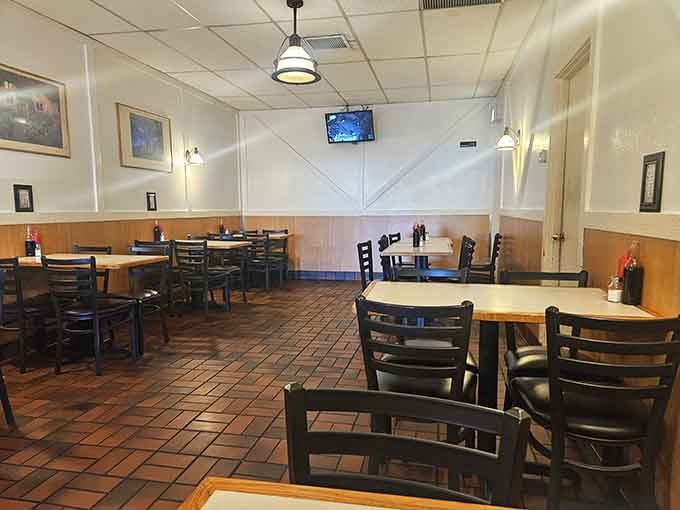 The dining room waits patiently between rushes, each table having witnessed countless moments of first-bite bliss and clean-plate satisfaction.
