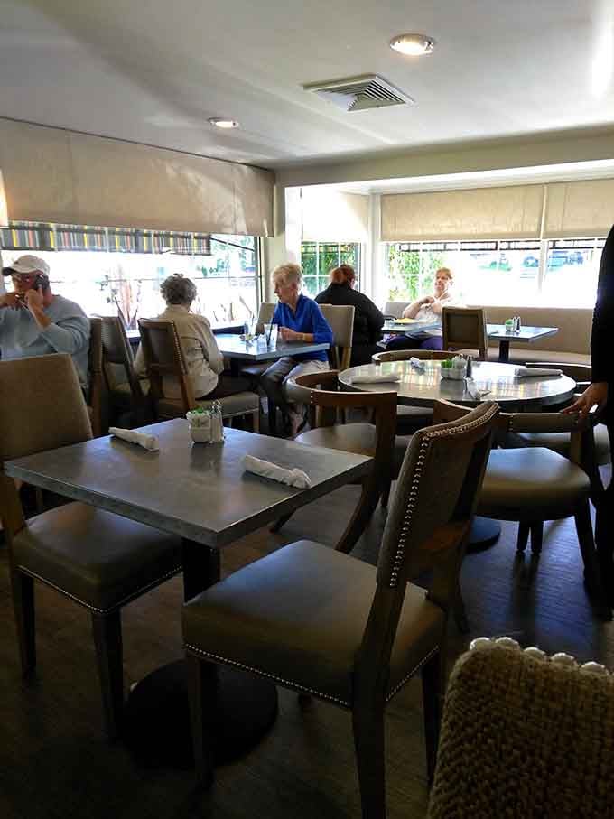 Comfortable seating that welcomes everyone from solo coffee sippers to families planning their day over stacks of pancakes.