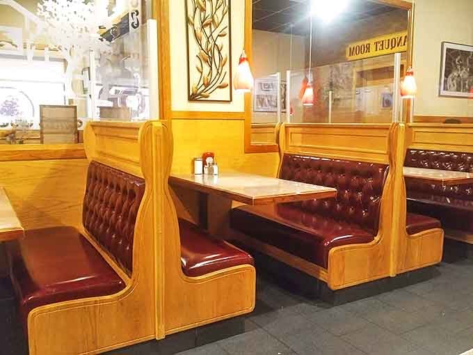 Classic diner booths with burgundy upholstery&mdash;the kind that have cradled countless first dates, family celebrations, and Sunday morning recovery missions.