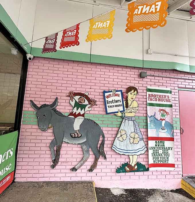 Whimsical wall art featuring donkeys and papel picado banners creates the authentic atmosphere that no corporate taco chain could ever replicate.