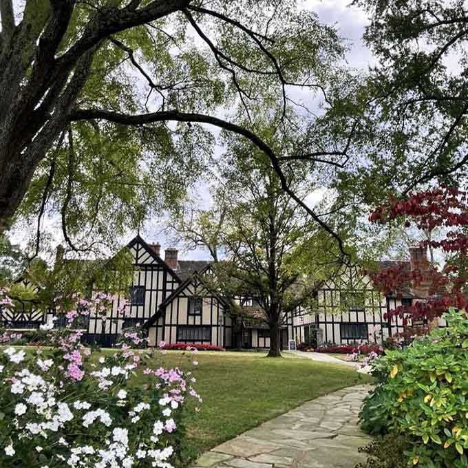 That manor house framed by blooming trees, proving that some views never get old no matter how often you see them.