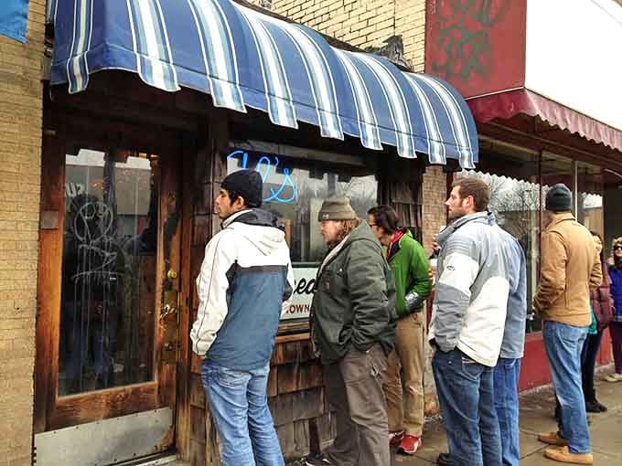 The line outside tells you everything you need to know about what's waiting inside this tiny treasure.