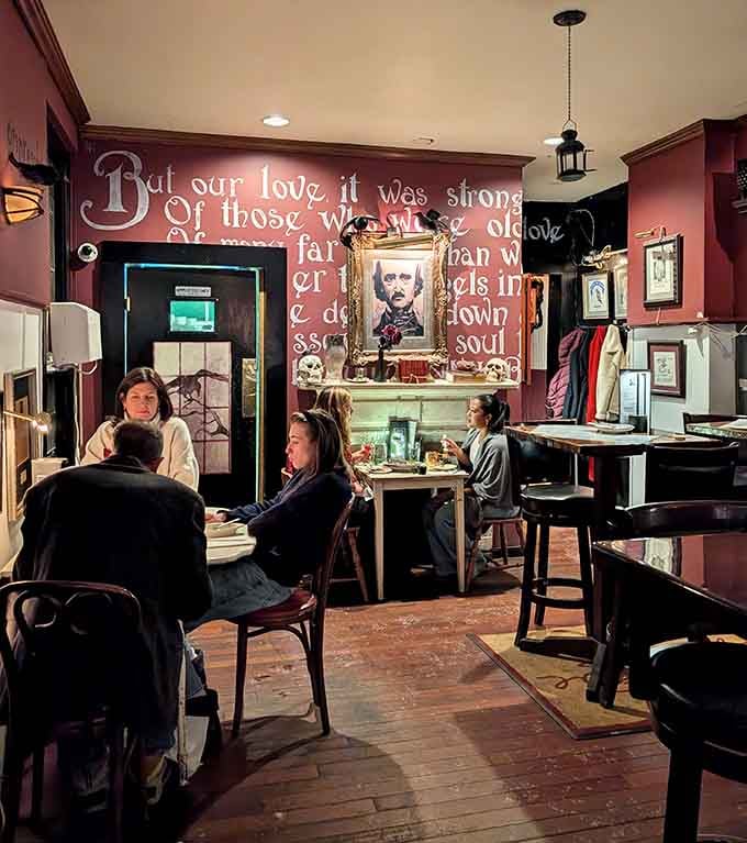 Diners gather beneath Poe's verses, proving literary atmosphere pairs surprisingly well with good conversation and better food.